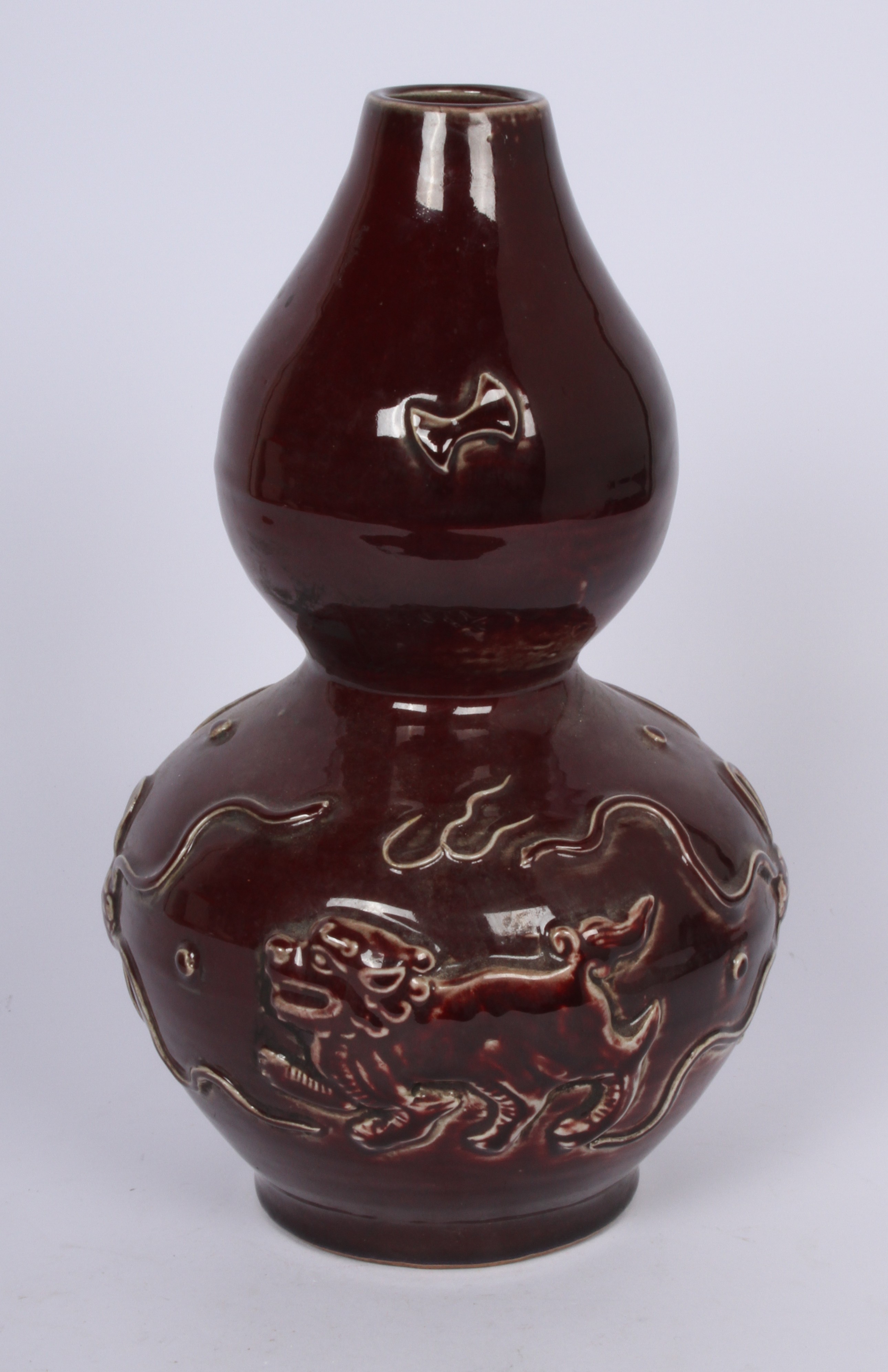 Lot 97 - A Chinese sang de boeuf double gourd vase,